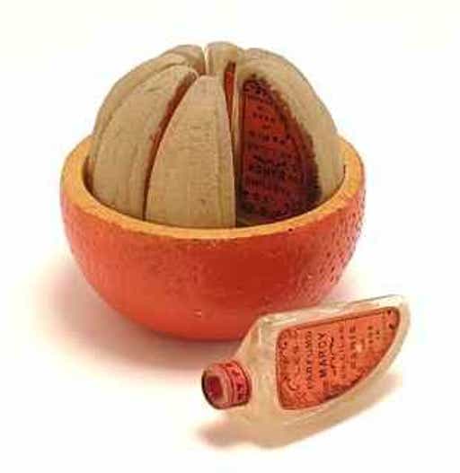 Unusual orange perfume bottle | The Museum of Ridiculously Interesting ...